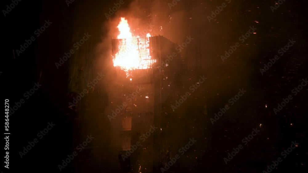 Close view of flames of a fire incident affecting a high rise ...