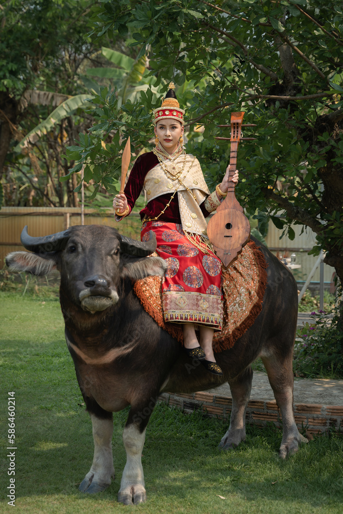 Pretty young Asian woman dressed elegantly in dress Luang Prabang Laos ...