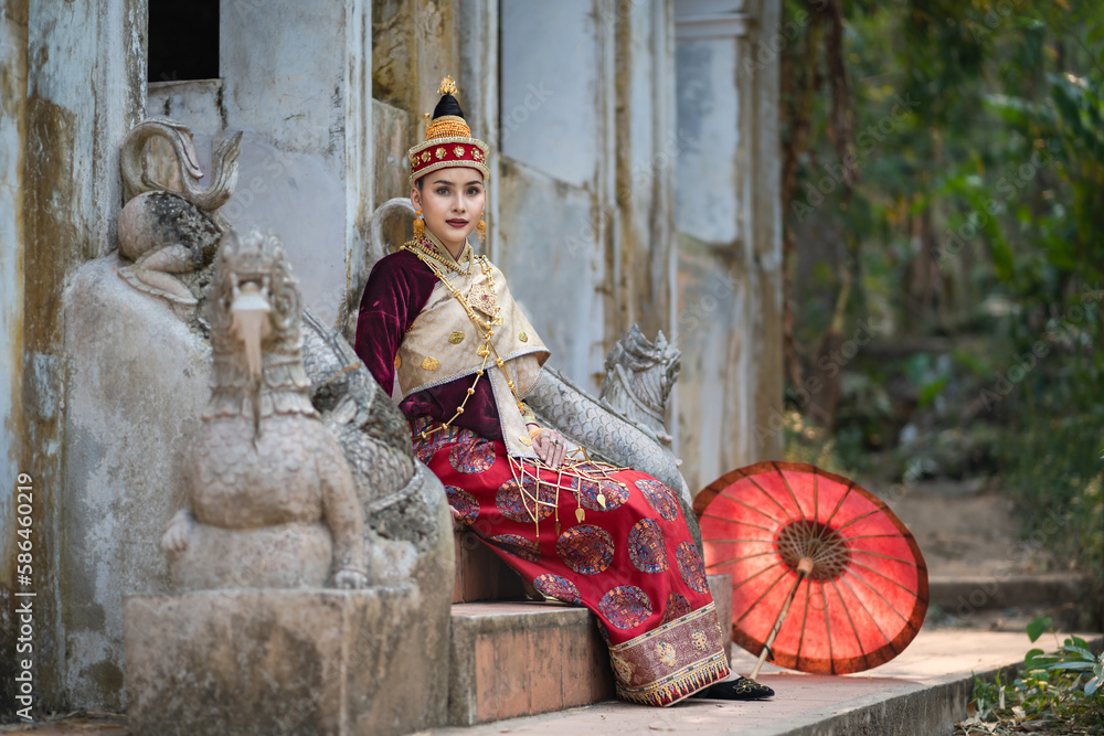 Pretty young Asian woman dressed elegantly in dress Luang Prabang Laos ...