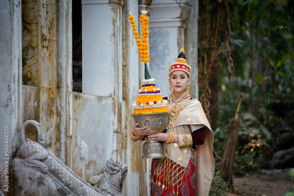 Foto de Pretty young Asian woman dressed elegantly in dress Luang ...