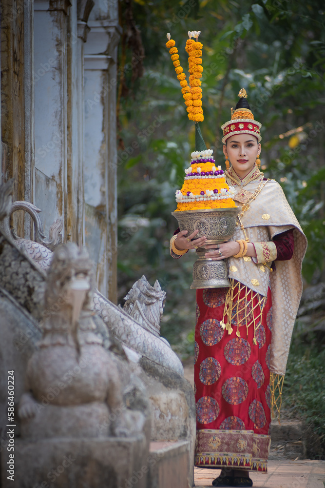 Pretty young Asian woman dressed elegantly in dress Luang Prabang Laos ...