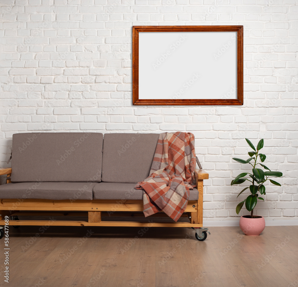 Loft style wooden sofa on white brick wall background with empty ...