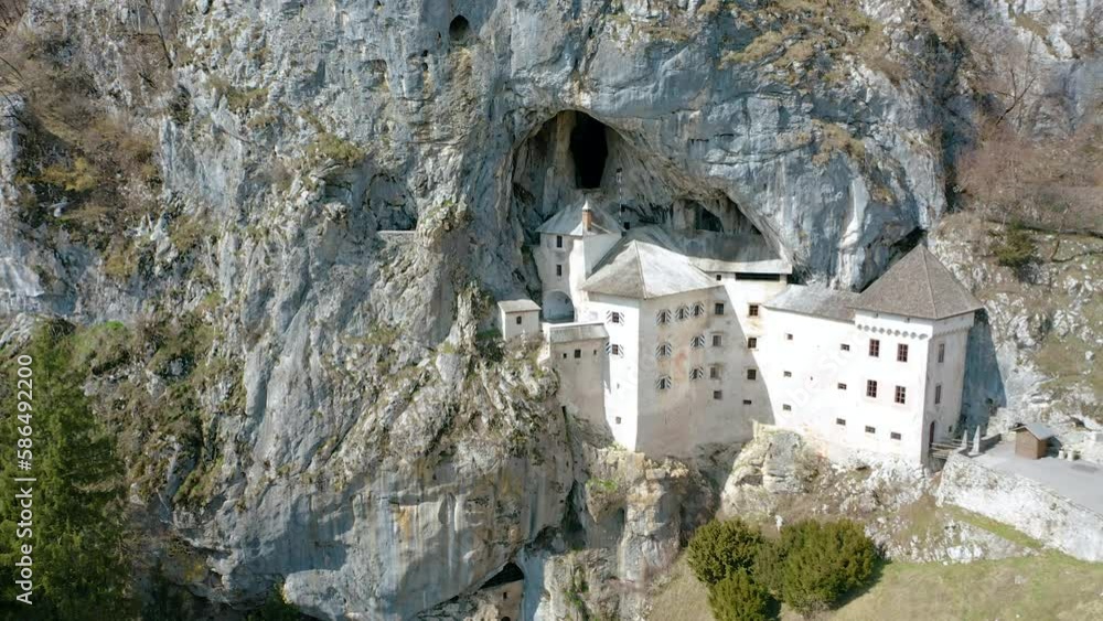Aerial Push Out Shot of Most Fascinating, Historic Medieval Predjama ...