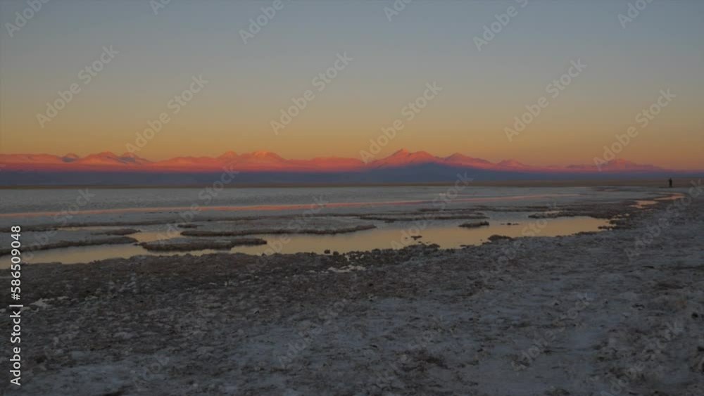 Arid plain of the Atacama desert with the Andes mountains behind, in ...