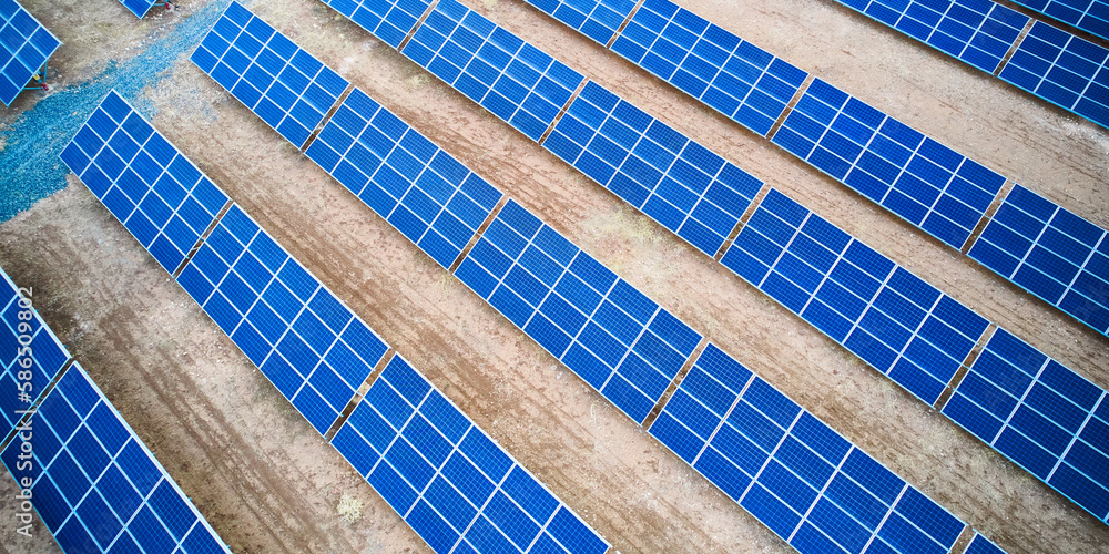 Aerial view of solar panel farm. Solar power station aerial view. Rows ...