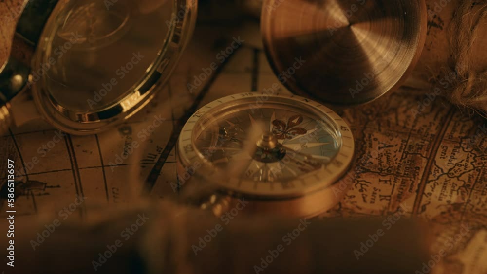 Compass and magnifier on a old vintage world map with countries and ...