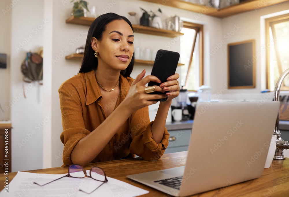 Remote work, phone and texting by business woman in kitchen with laptop ...