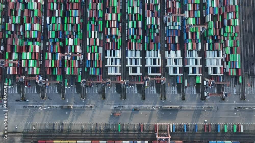 Bird's eye view of a bustling container shipping terminal, showcasing ...