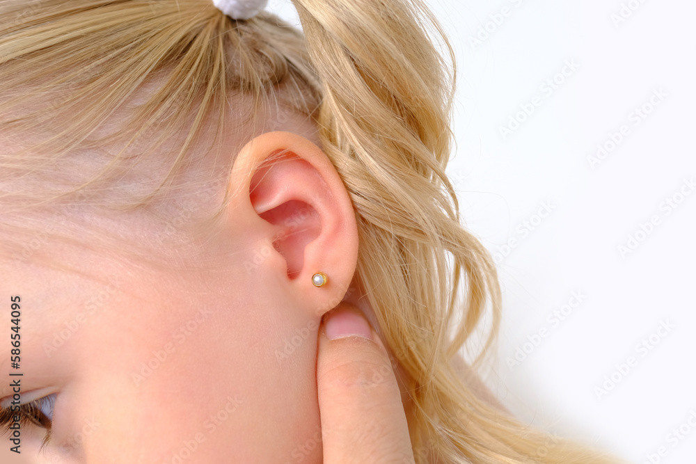 ear small patient, child, girl 3 years old, part face in profile close ...