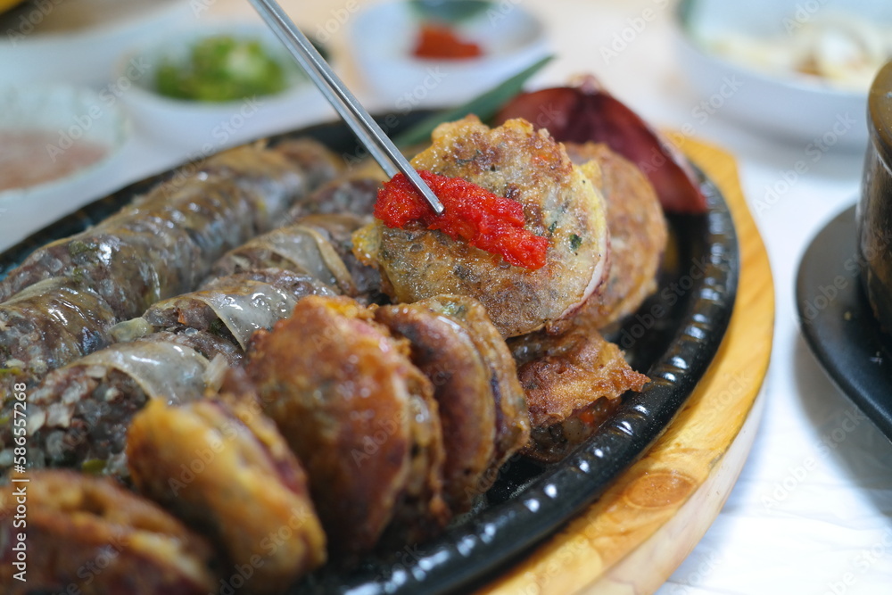 For this korean dish, clean the squid, remove the innards, fill with ...