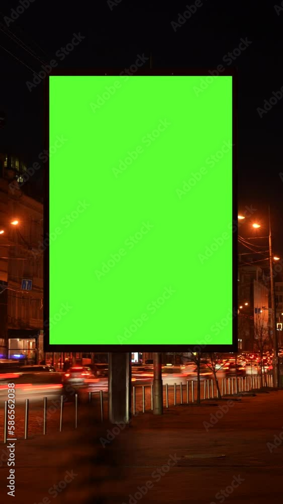 Vertical Screen: timelapse of green screen billboard with night traffic ...