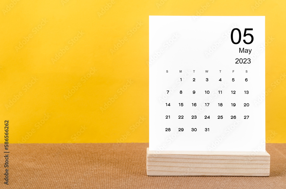 The May 2023 Monthly calendar for 2023 year on yellow table. Stock ...