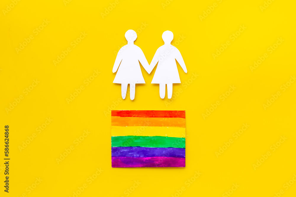 Gay pride rainbow LGBT flag with women couple paper shapes. LGBT social ...