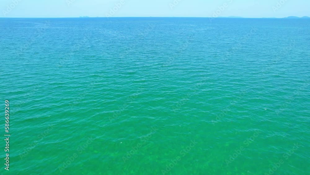 The crystal-clear waters of the ocean appear inviting, revealing a ...