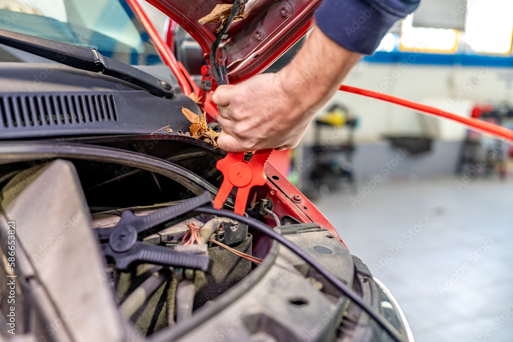 starting the car engine using the starter cable Stock Photo | Adobe Stock