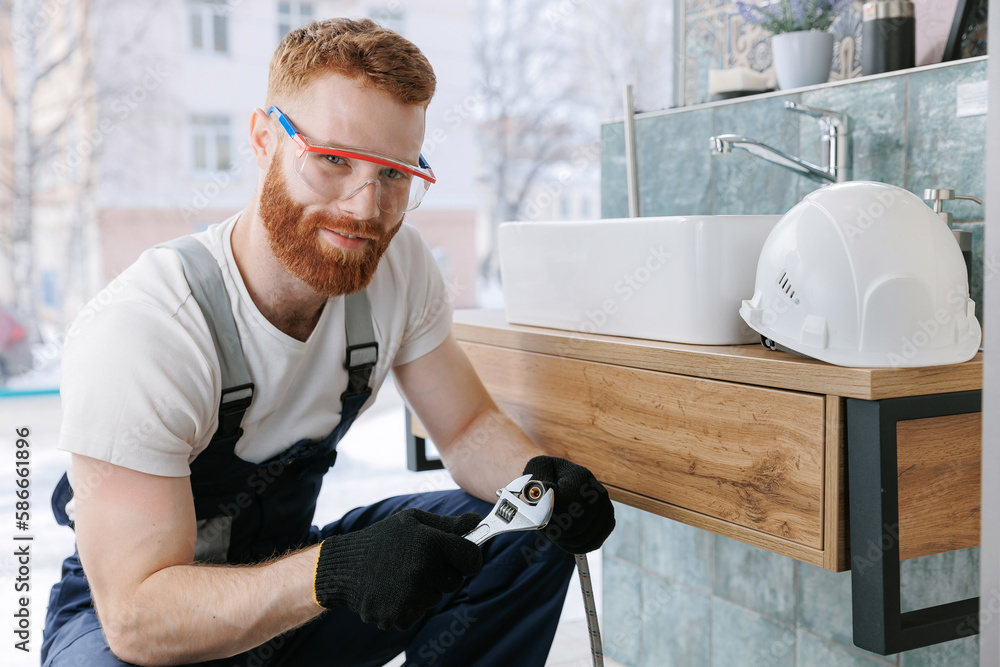 Plumber man at work in bathroom, fix repair service. Concept assemble ...