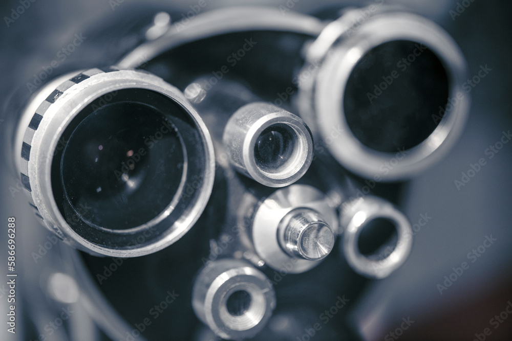 Old style movie projector, close-up. Vintage old movie camera optics ...