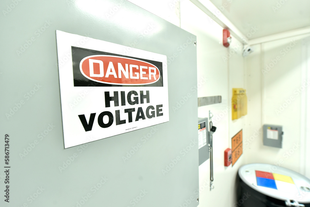 Danger High Voltage signs taped to a door before entering a high ...