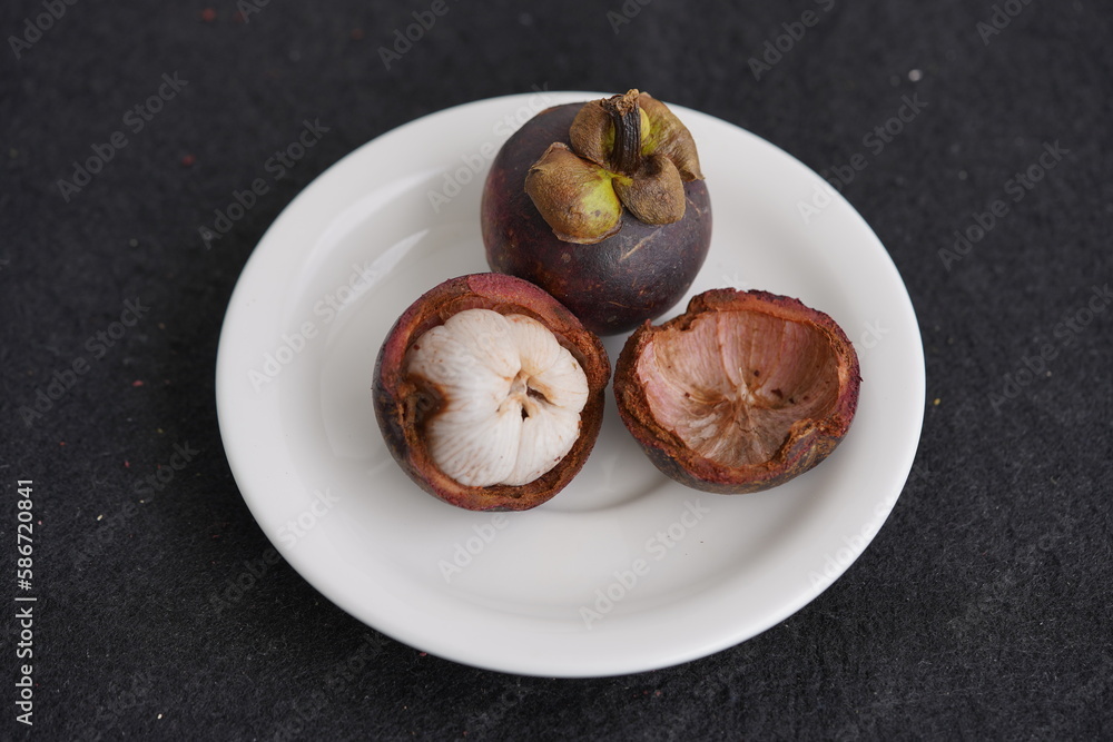 Mangosteen (Garcinia mangostana), also known as the purple mangosteen ...