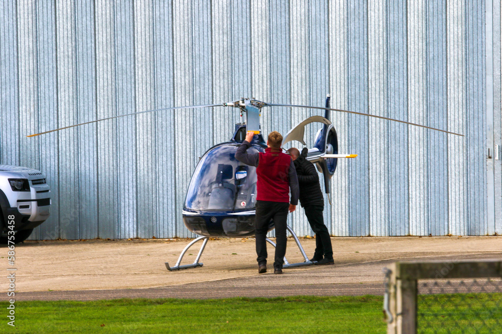 Preparing a training helicopter for flight. Stock Photo | Adobe Stock