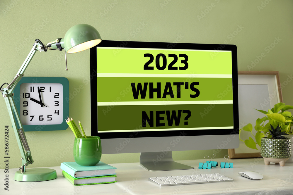 Future trends. 2023 What's New? text on computer monitor. Workplace ...