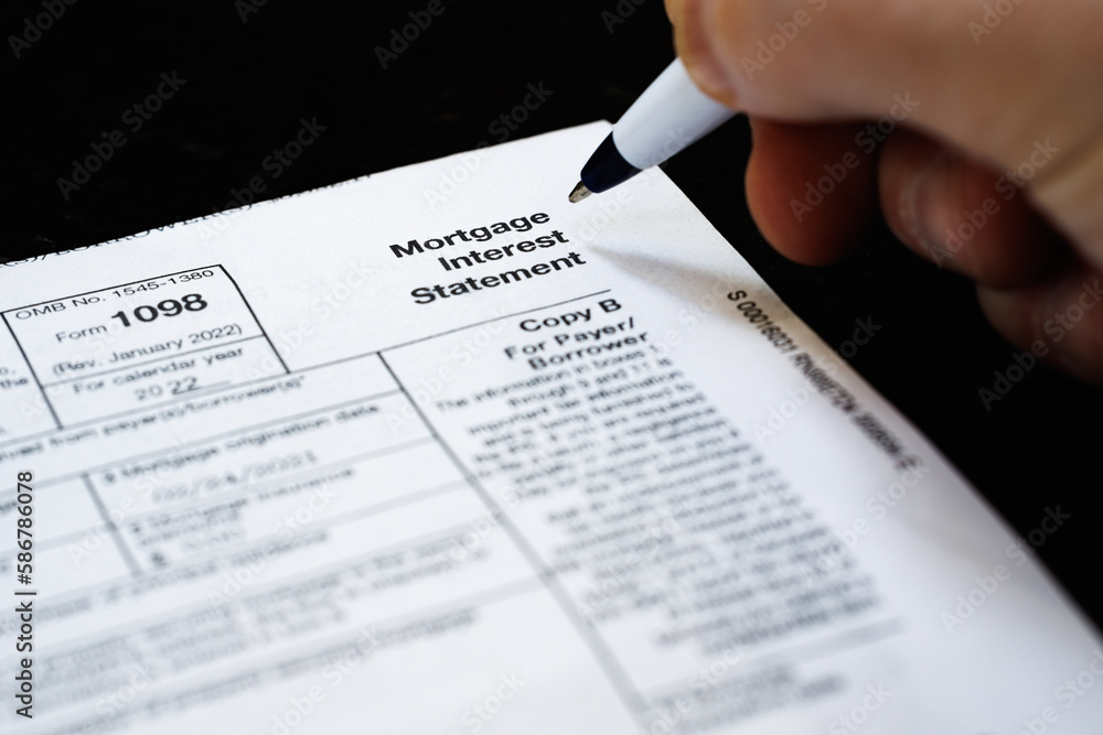 1098 Tax form, Mortgage Interest Statement, IRS document. Pen hand ...