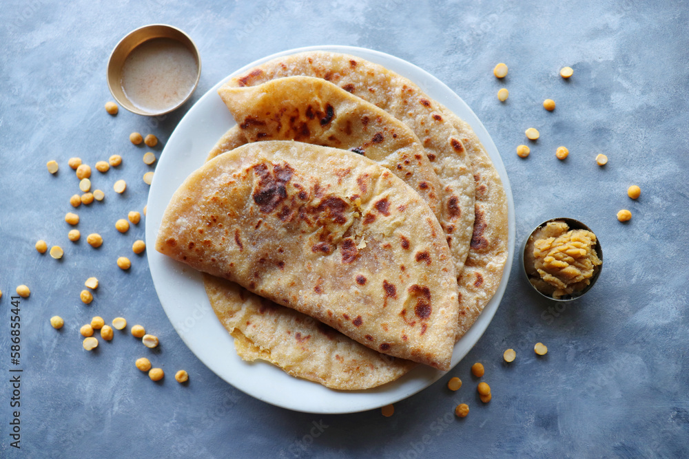 Puran Poli is an Indian sweet flatbread stuffed with chana dal, jaggery ...