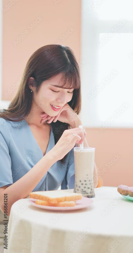 girl drink bubble tea with snacks Stock ビデオ | Adobe Stock