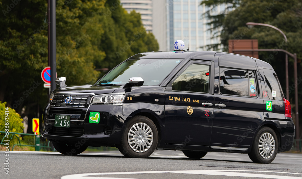 Tokyo taxi. Photo with a black cab car as a taxi on the streets of ...