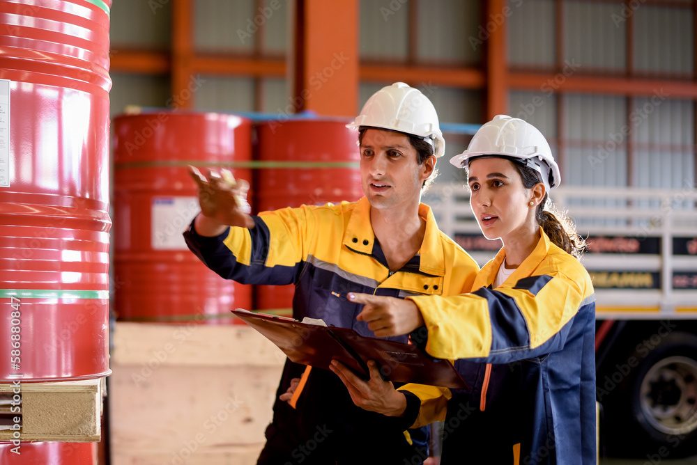 two young engineer assistant in helmet inspection check heavy machine ...