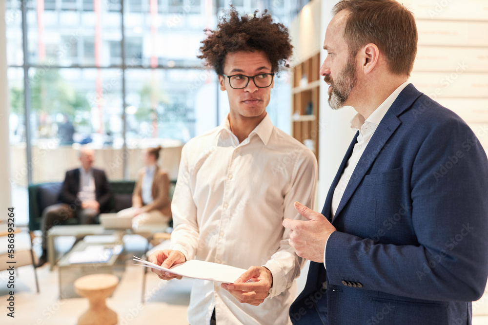 Consultant gives young business startup founder tips Stock Photo ...