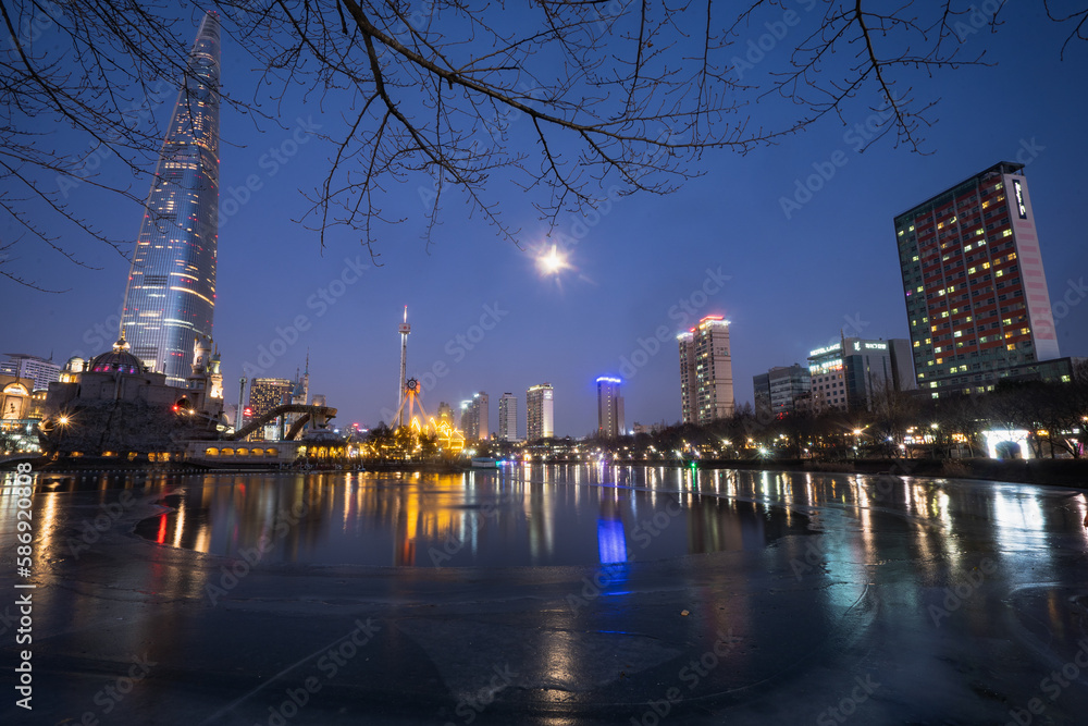 Seokchon Lake Park with Seoul Sky and Lotte World's Magic Island during ...