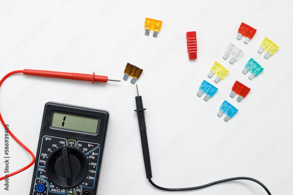Digital multimeter for measuring electrical elements and car fuses on a ...