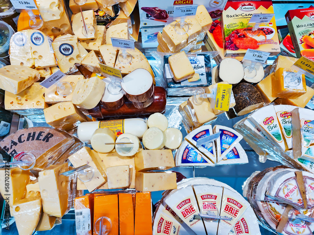 Latvia, Riga, March, 2023 - A large selection of cheeses with different ...