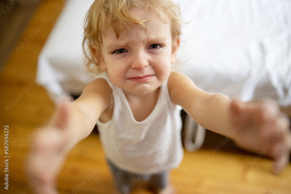 Cute little blond child is crying. Crying child, stress, pain, sadness ...