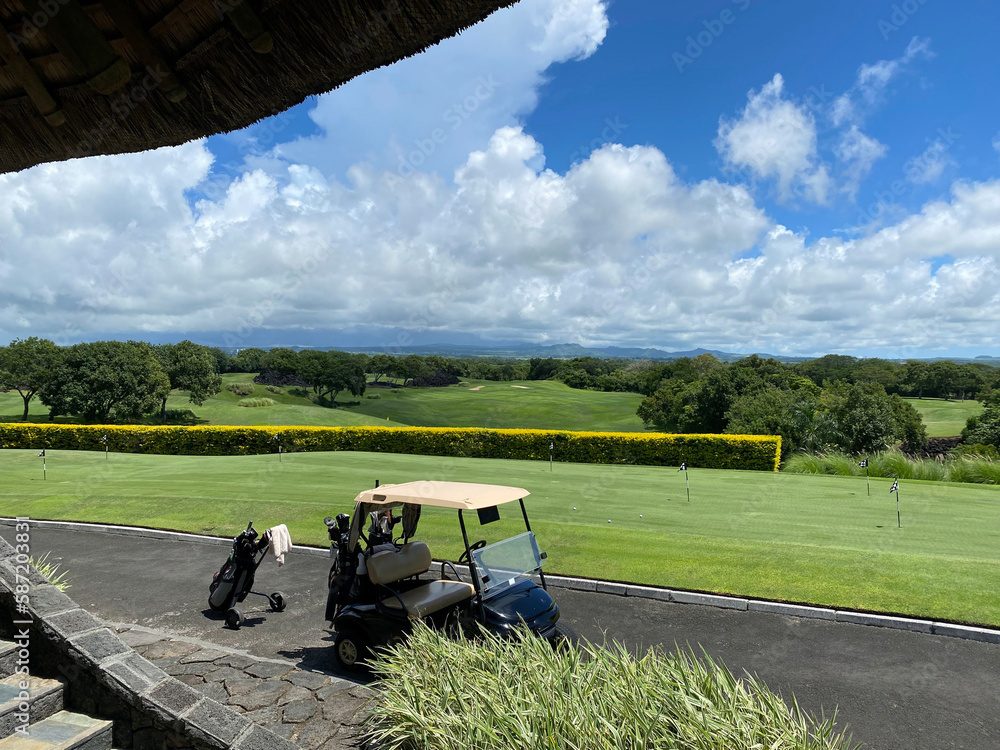 Golf cart of golf course with green grass field with blue sky Stock ...