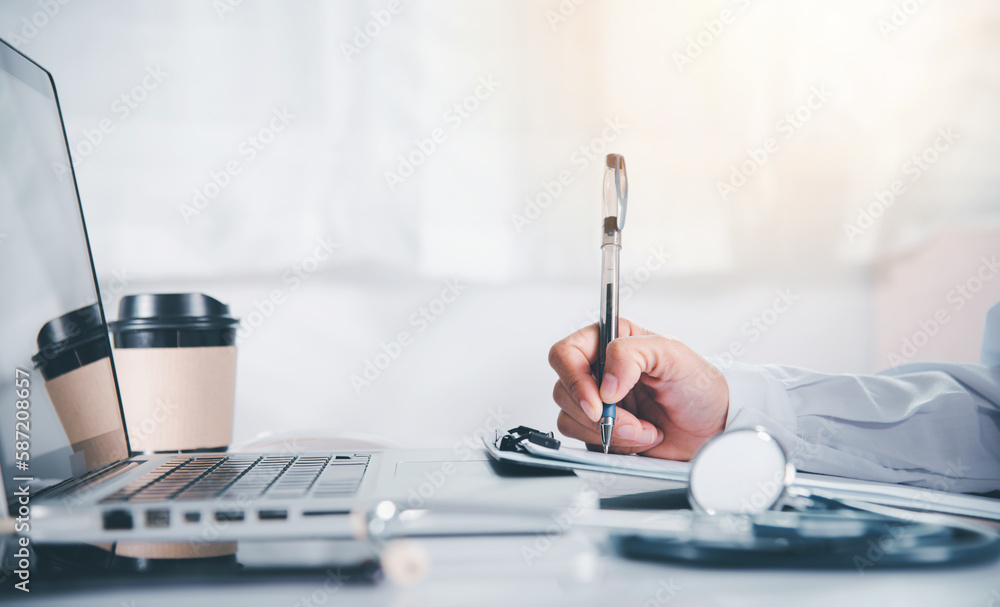 Doctor Day Concept. Nurse in uniform with doctor stethoscope writing ...