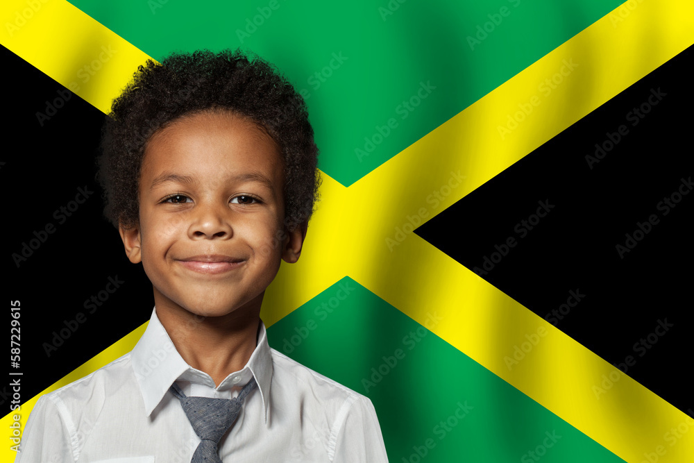 Jamaican kid boy on flag of Jamaica background. Education and childhood ...