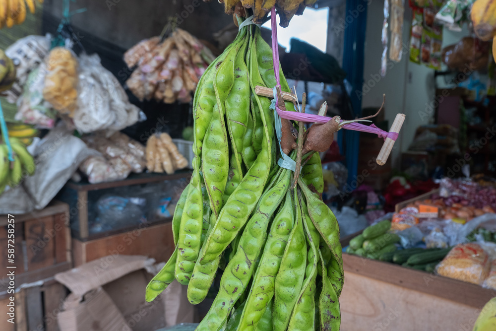 Petai, petai or mlanding (Parkia speciosa) are hung and sold in ...