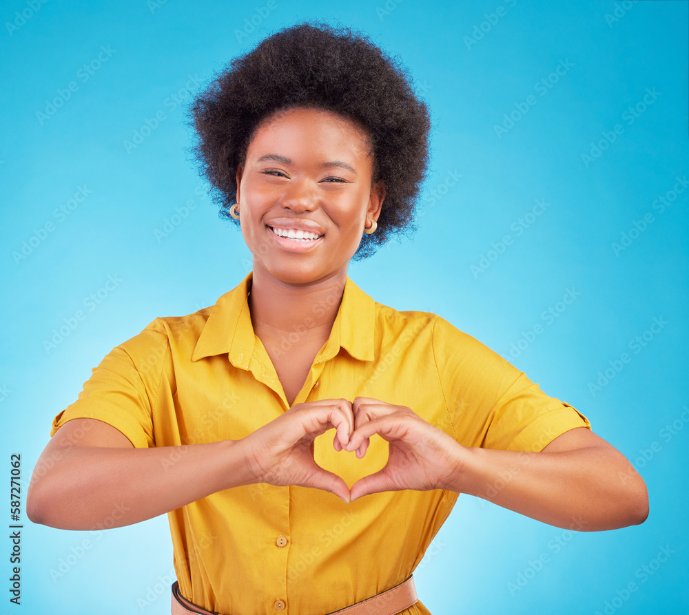 Heart hands, happy black woman and portrait in studio, blue background ...