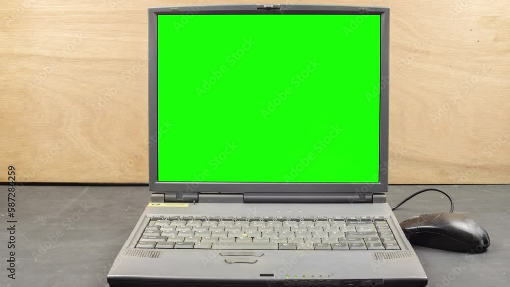 Lap top computer green screen ready for keying. Camera dolly mouse ...