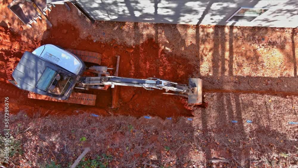 During earthmoving works at construction site crawler excavators ...