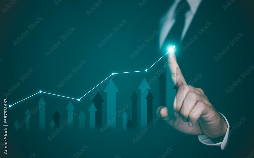 Businessman pointing arrow graph corporate future growth plan. Business ...