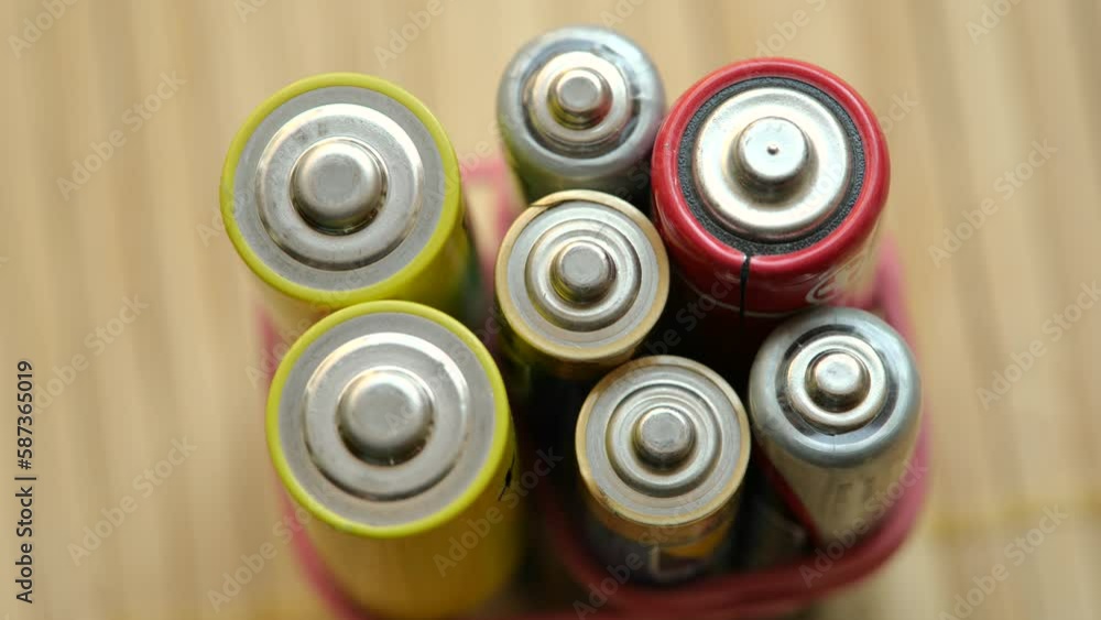 A bunch of generic old rechargeable alkaline batteries of different ...