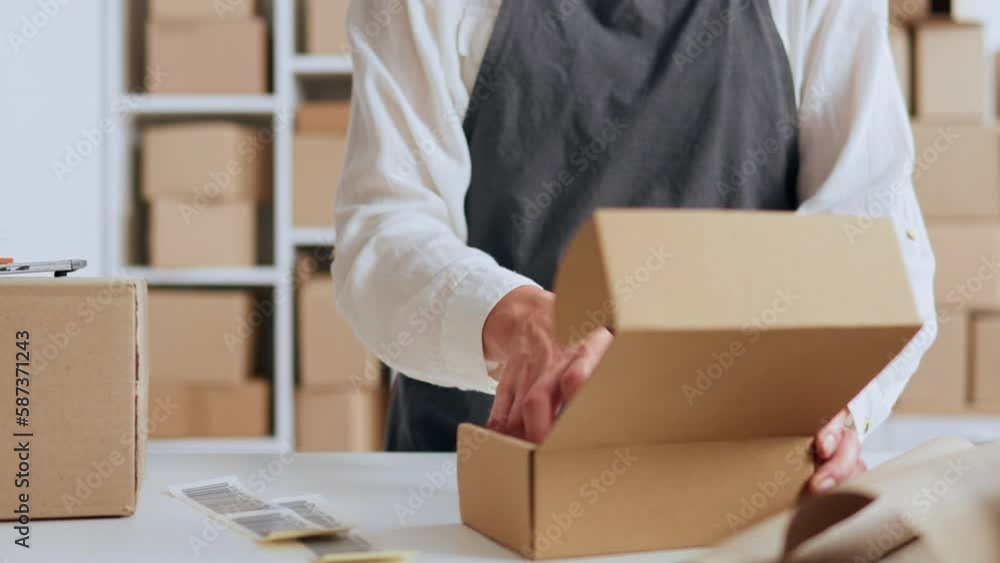 Logistics, Business woman Confidently packs the goods in a box in the ...