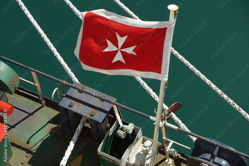 Malta flag, red banner with white cross, flying in aft part oft ...
