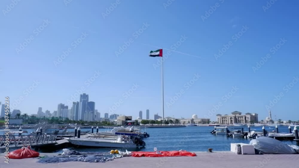 Sharjah, the UAE flag flies from a huge pole in the sky over Flag ...