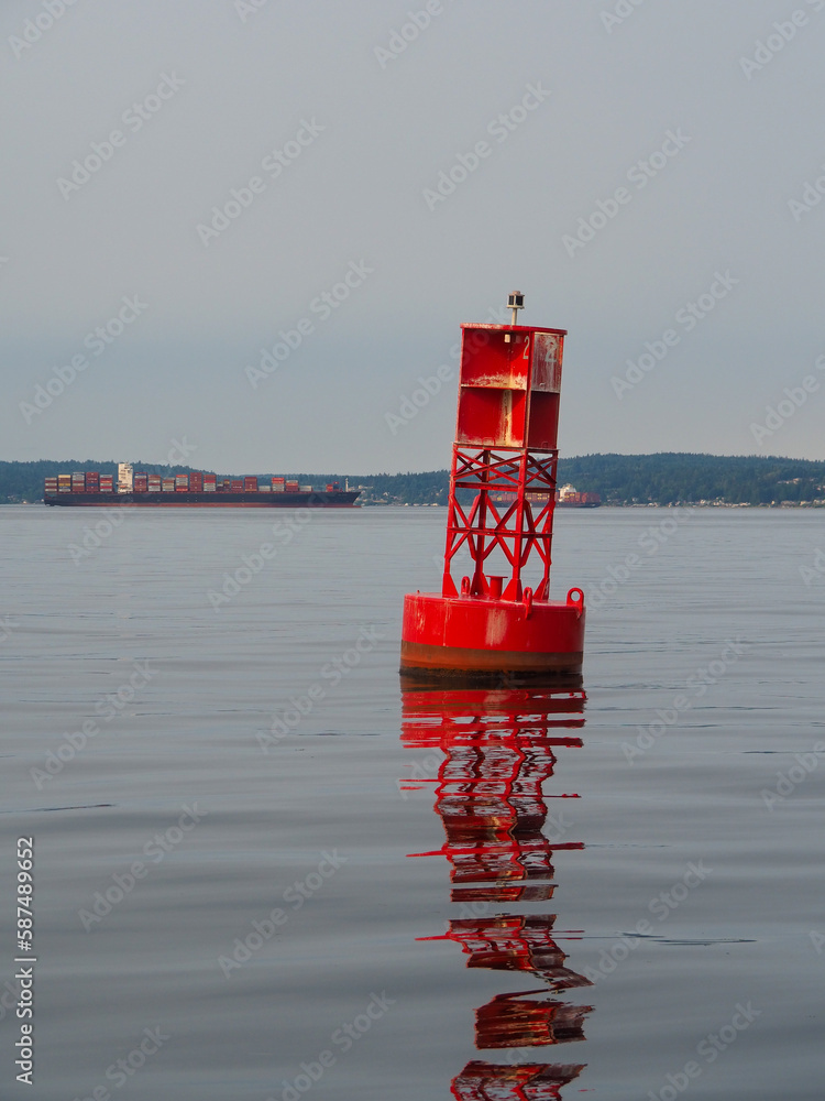 'Red, right, returning' maritime navigational marker in calm seas with ...