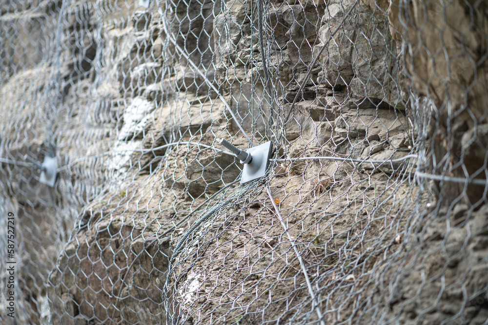 Reinforcing mountain slope with metal mesh and concrete reinforcement ...