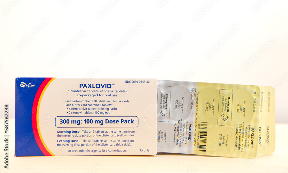 March 31, 2023: Box of Pfizer brand Paxlovid on a light wood table with ...
